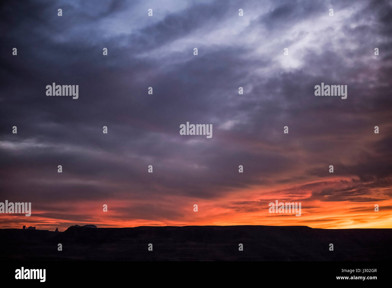 Dramatic colorful red purple and stormy sunset in goosenecks park in ...