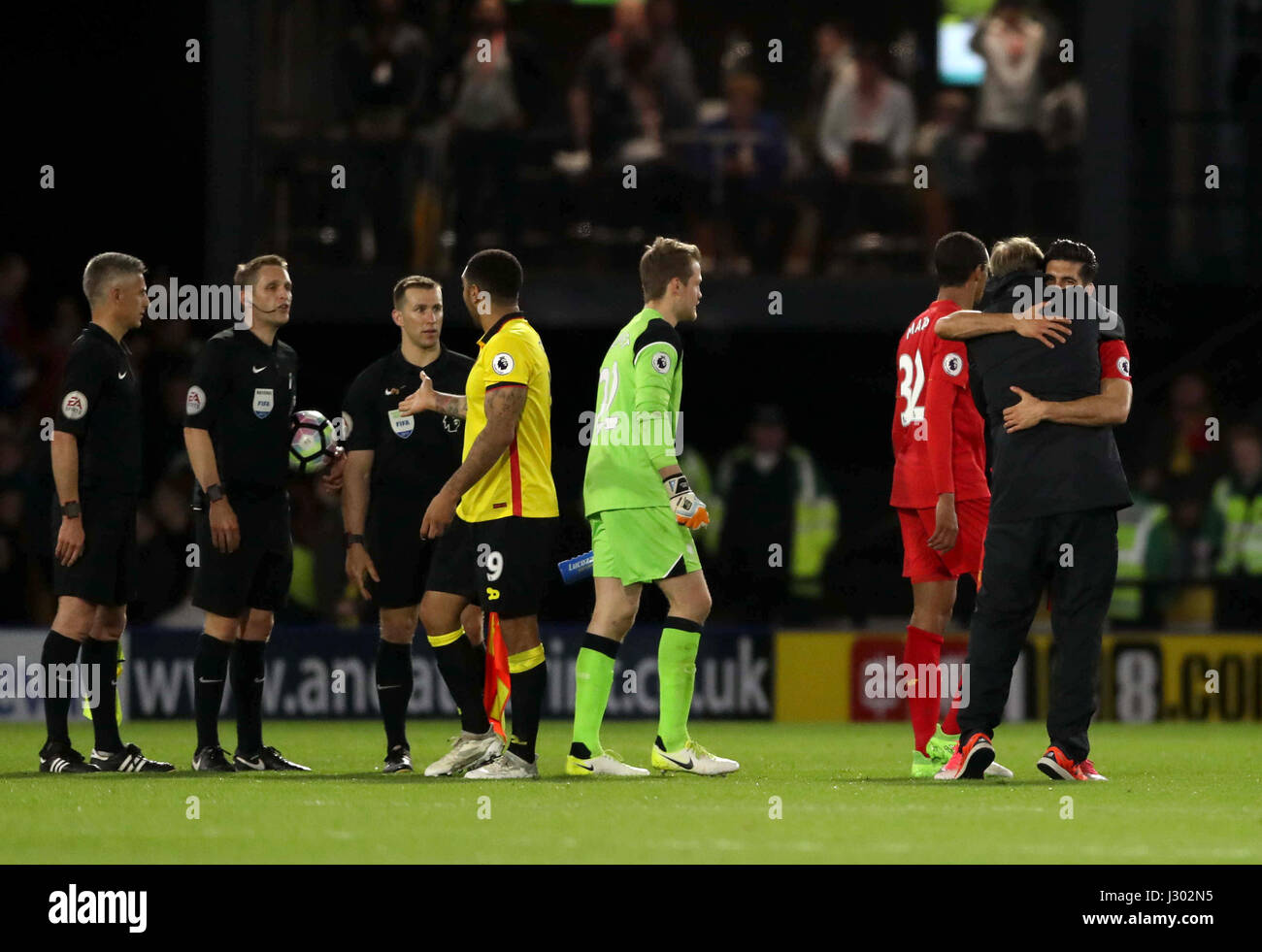 Liverpool manager Jurgen Klopp hugs player Emre Can as Watford's Troy ...