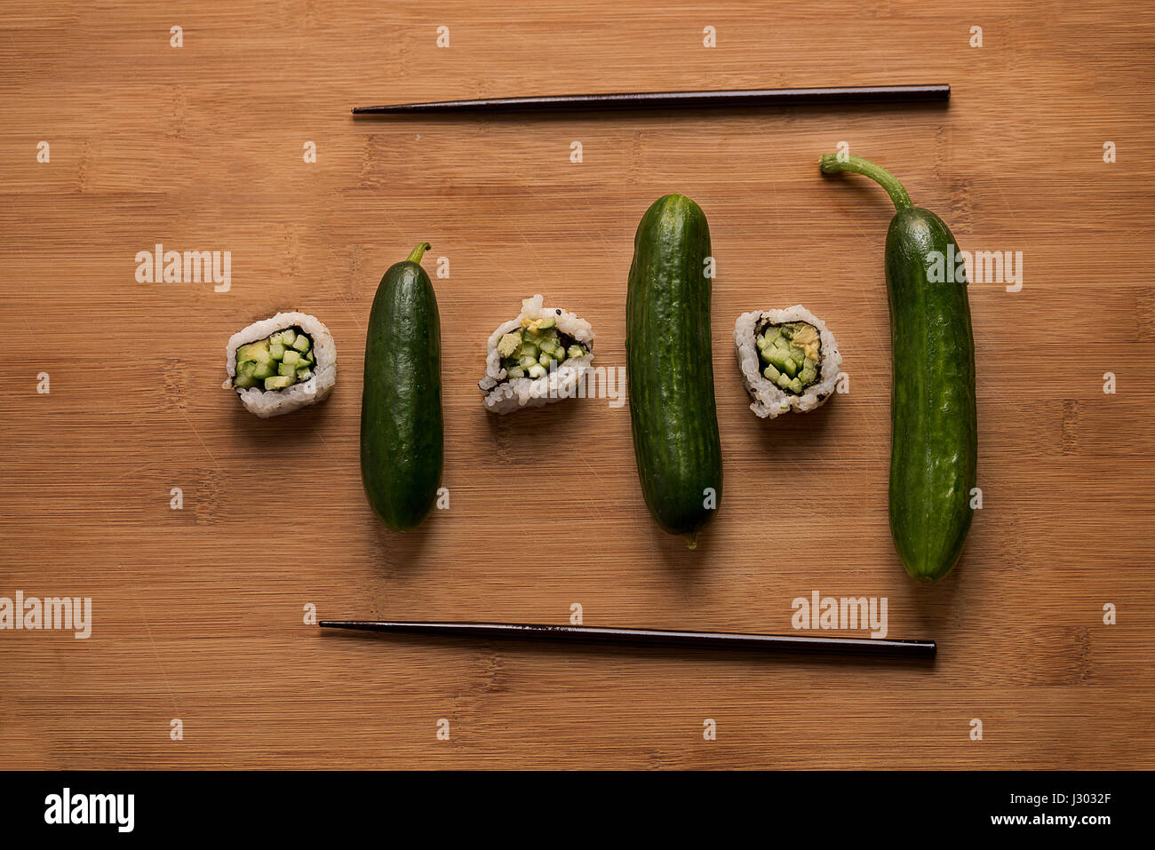 A fresh cucumber and avocado sushi roll Stock Photo - Alamy