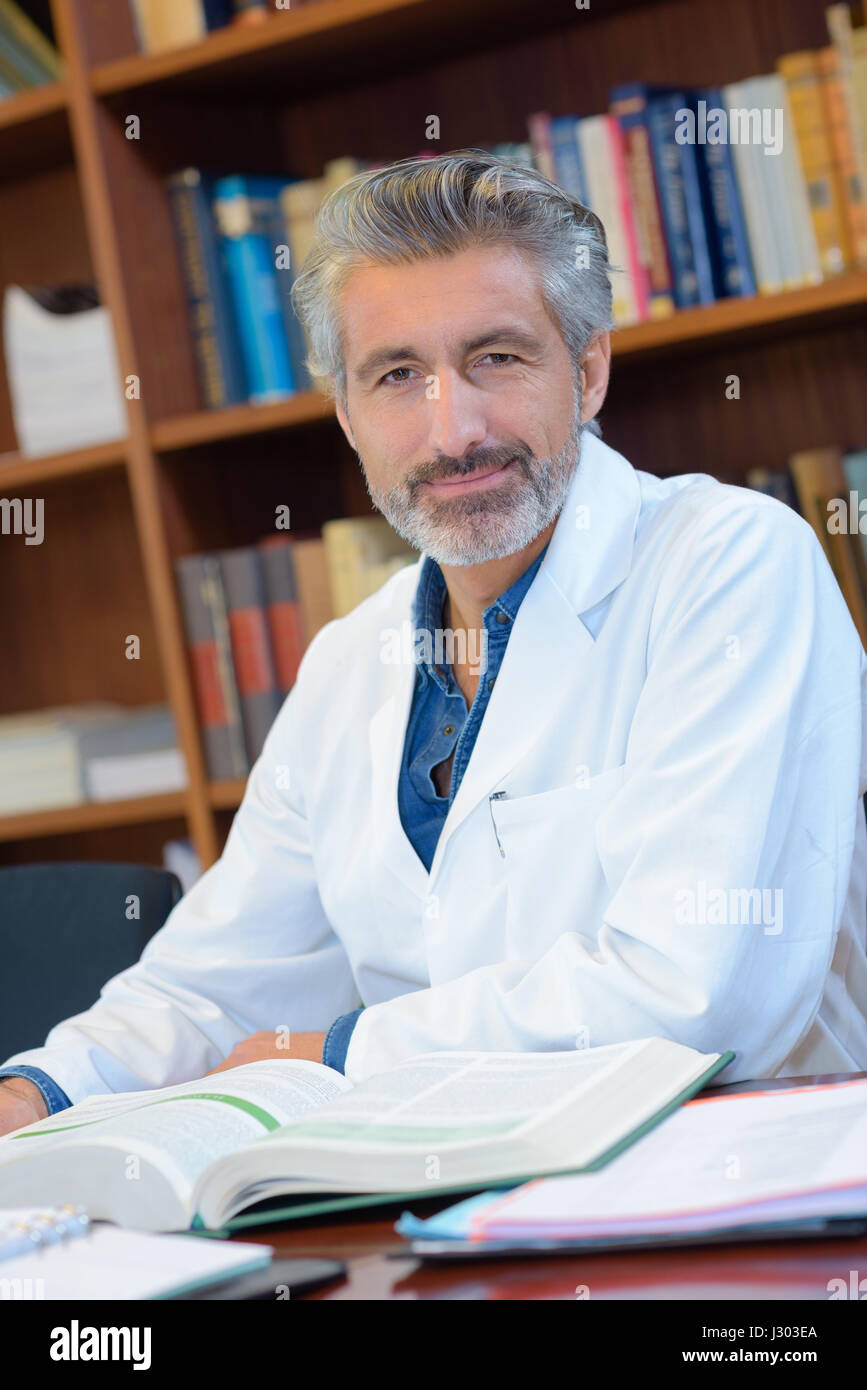 doctor reading some books Stock Photo - Alamy