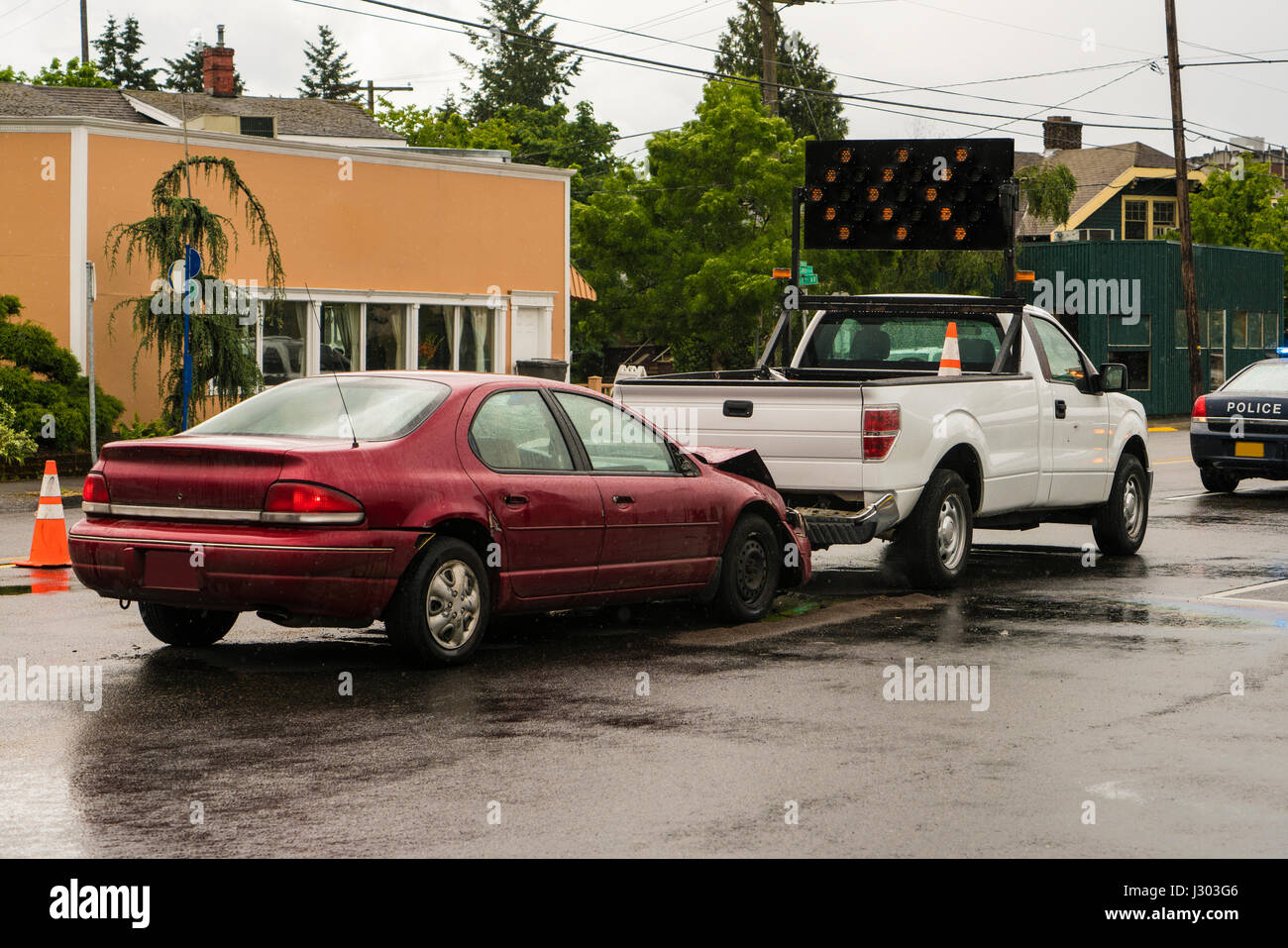 Traffic accident in the rain between a signal truck in the passenger ...