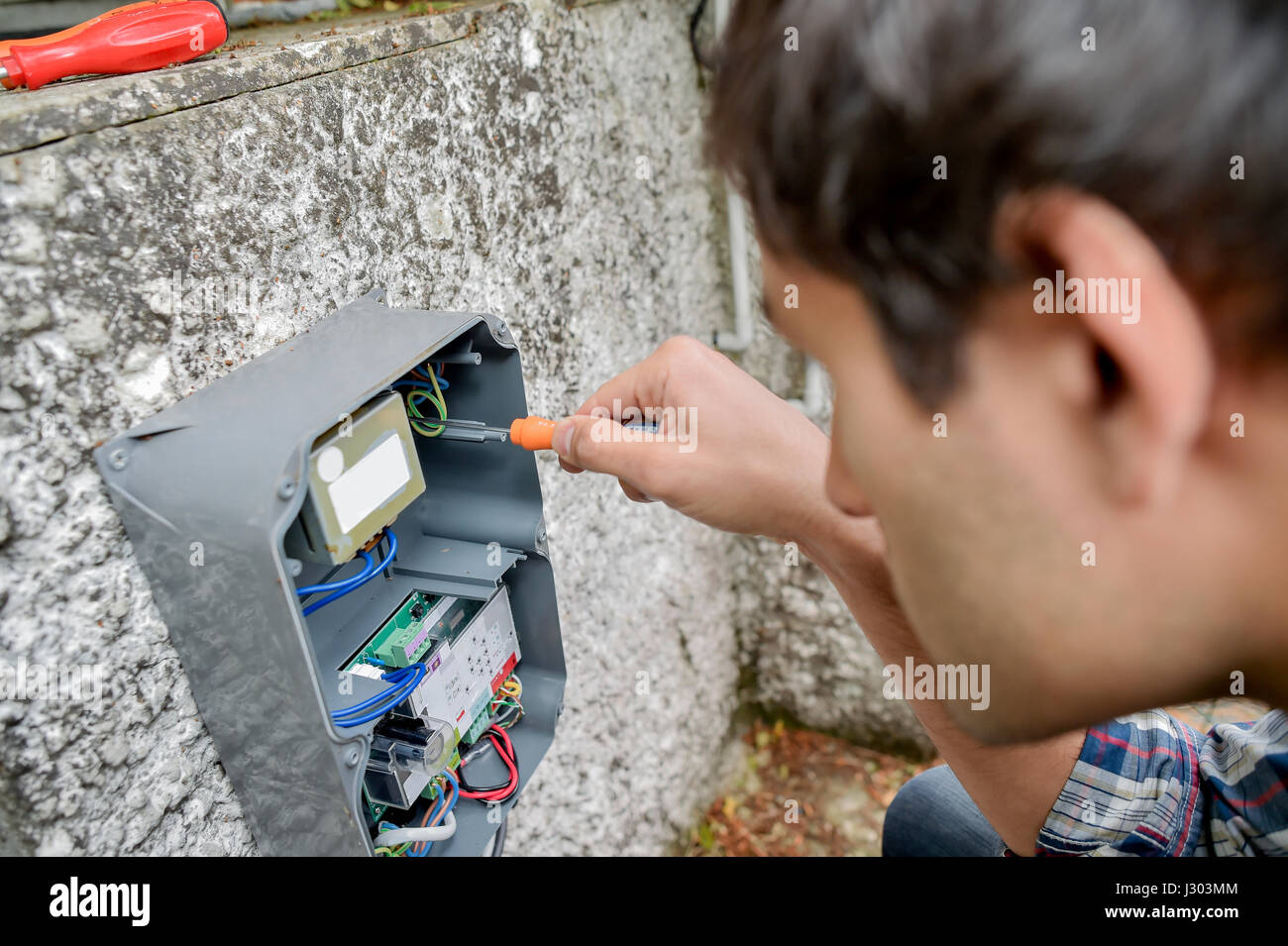 man fixing meter Stock Photo - Alamy