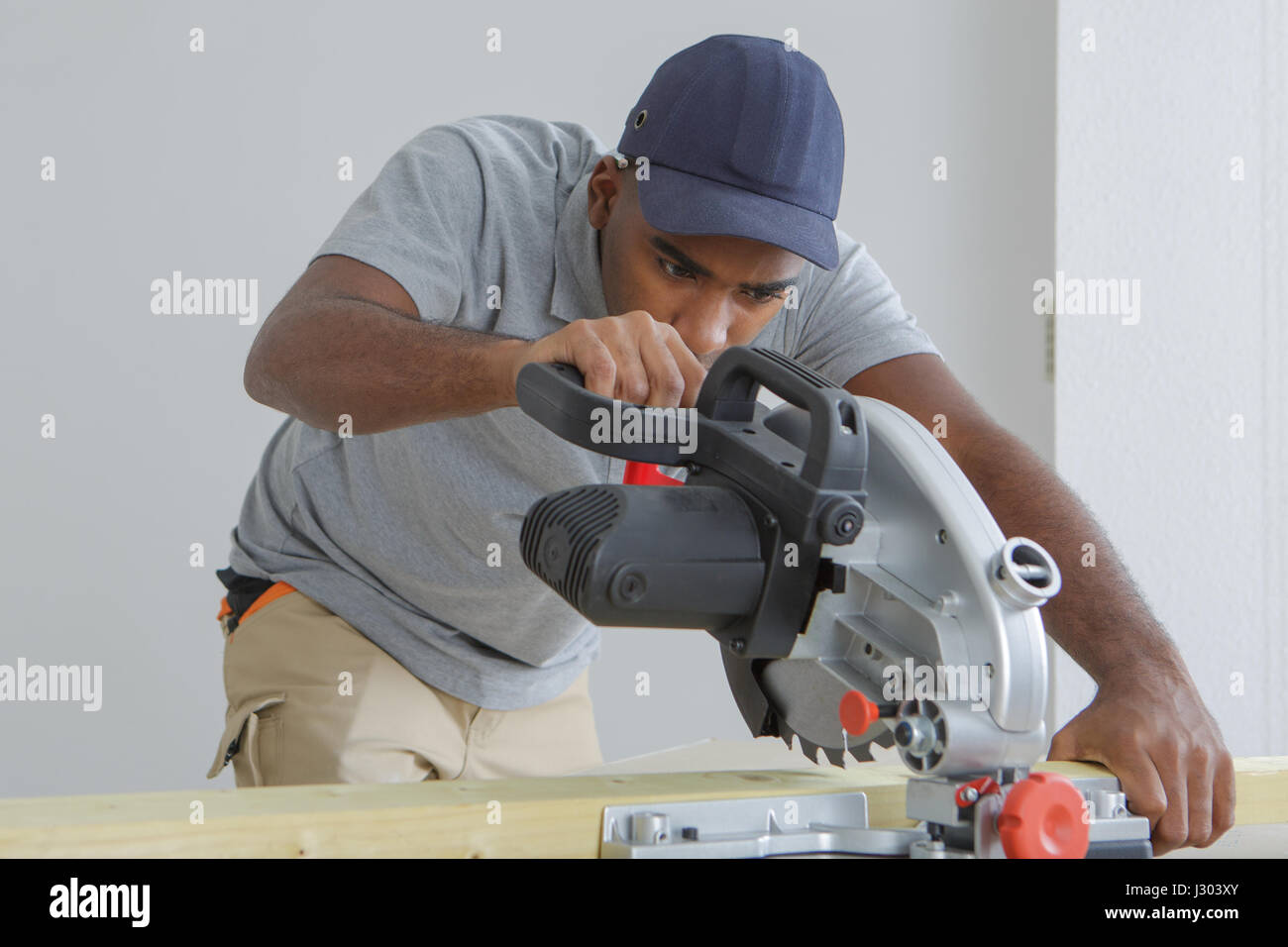 Man using circular saw Stock Photo - Alamy