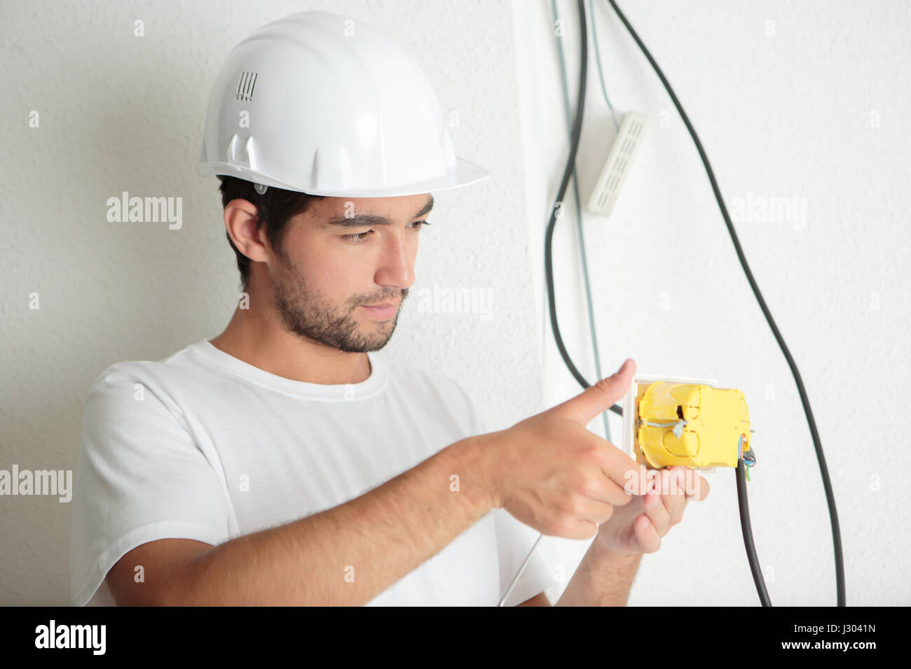 fixing the electrical wires Stock Photo - Alamy