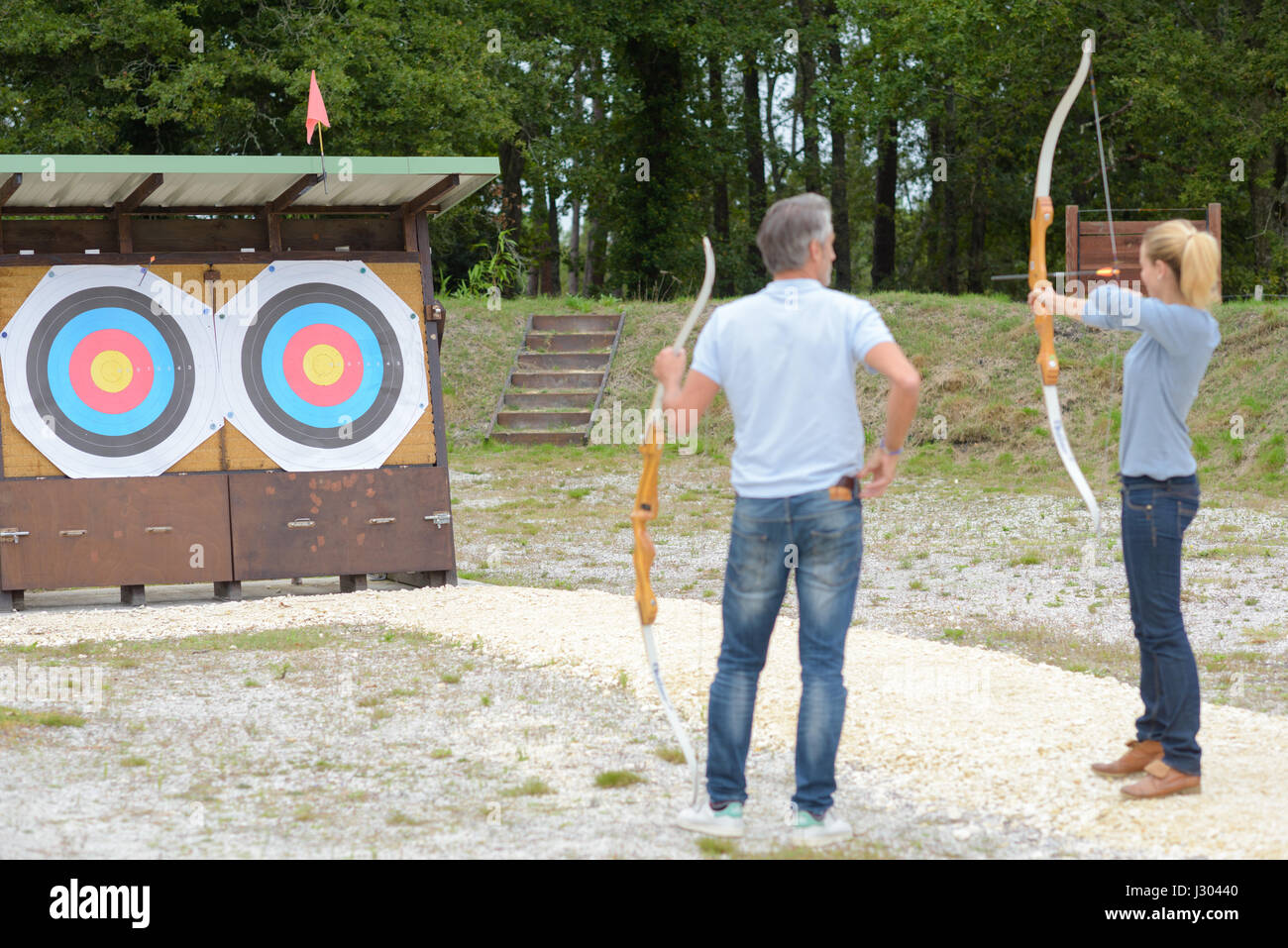 pulling the arrow's string Stock Photo - Alamy
