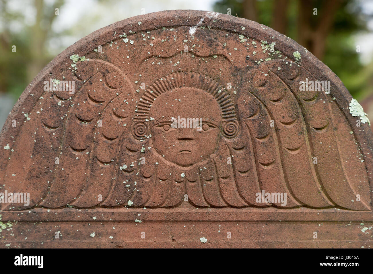 Details of a face on the top of a Revolutionary War era tombstone Stock ...