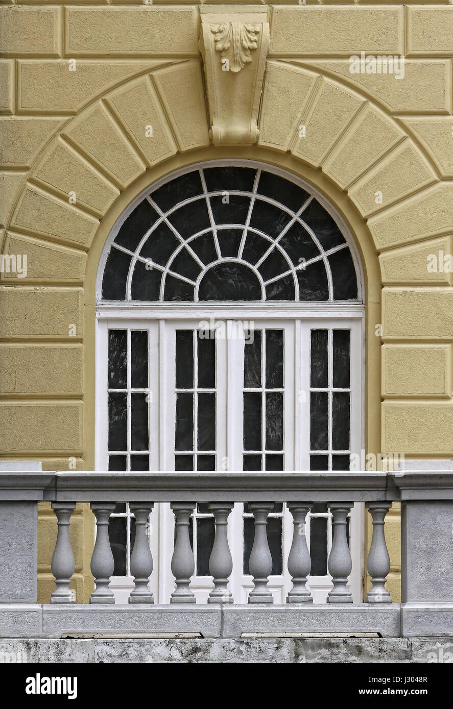 Vaulted mansion window with carved stone fence Stock Photo - Alamy