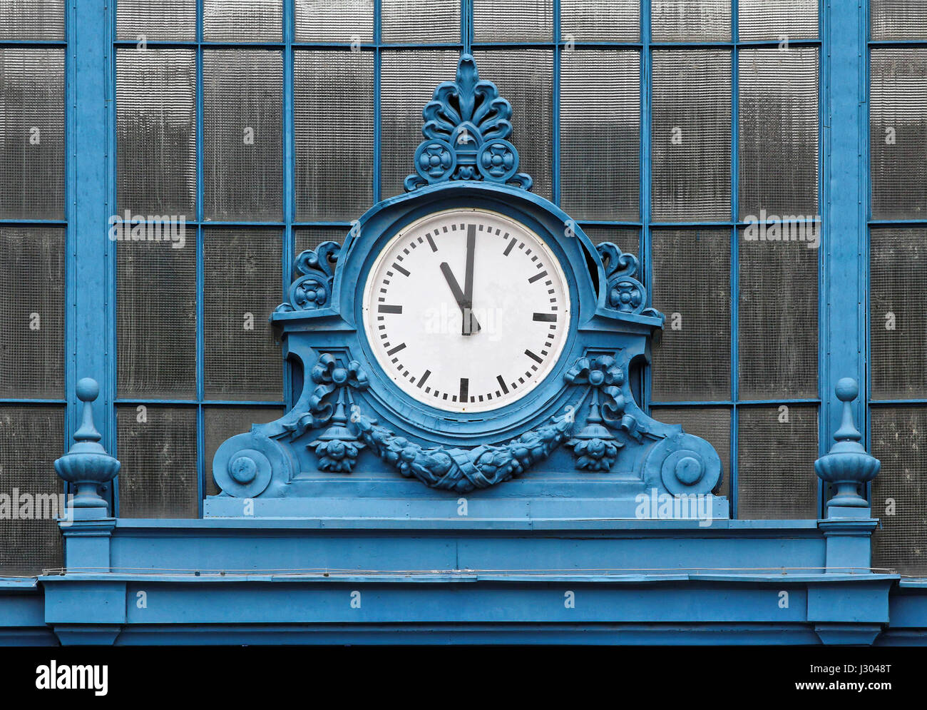 Eleven hours show the train station clock Stock Photo - Alamy