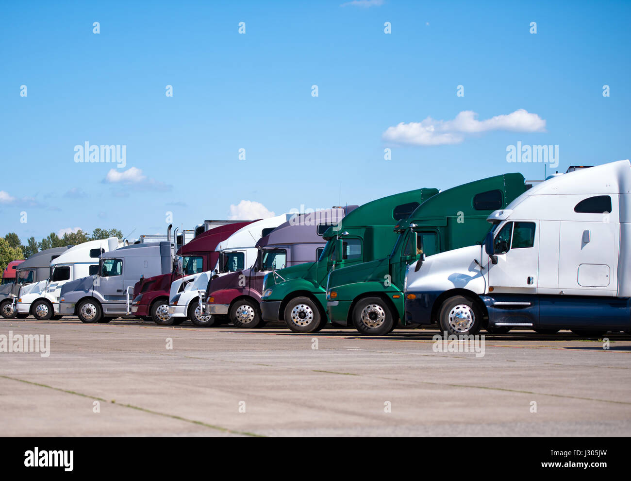 Semi trucks of different brands of classical and modern styles and ...
