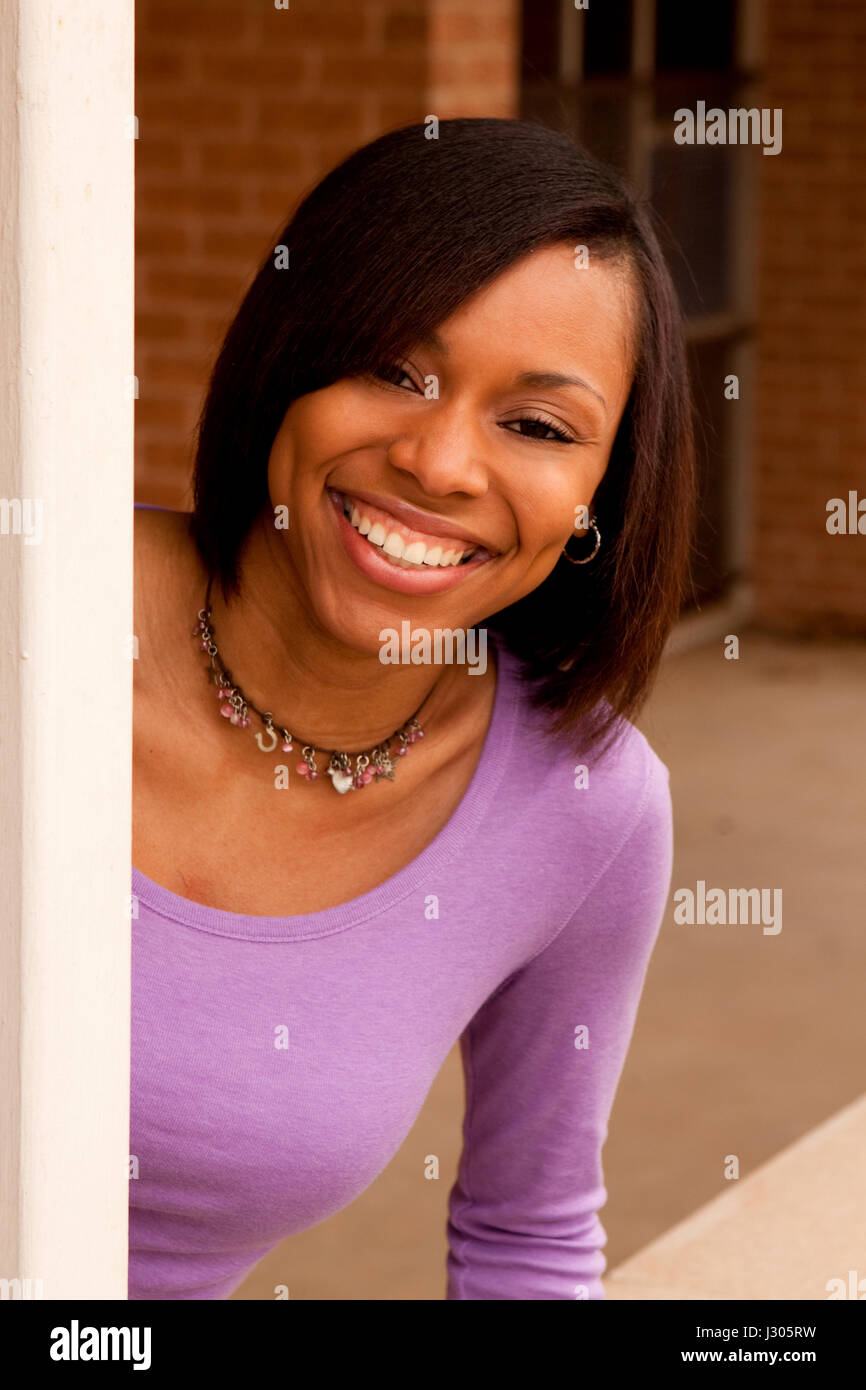 Beautiful young African American woman smiling Stock Photo - Alamy
