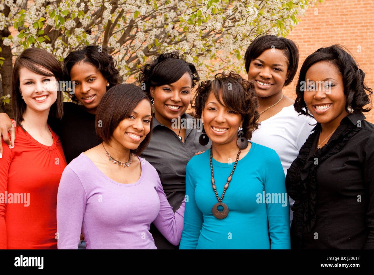 Diverse group of friends talking and laughing Stock Photo - Alamy