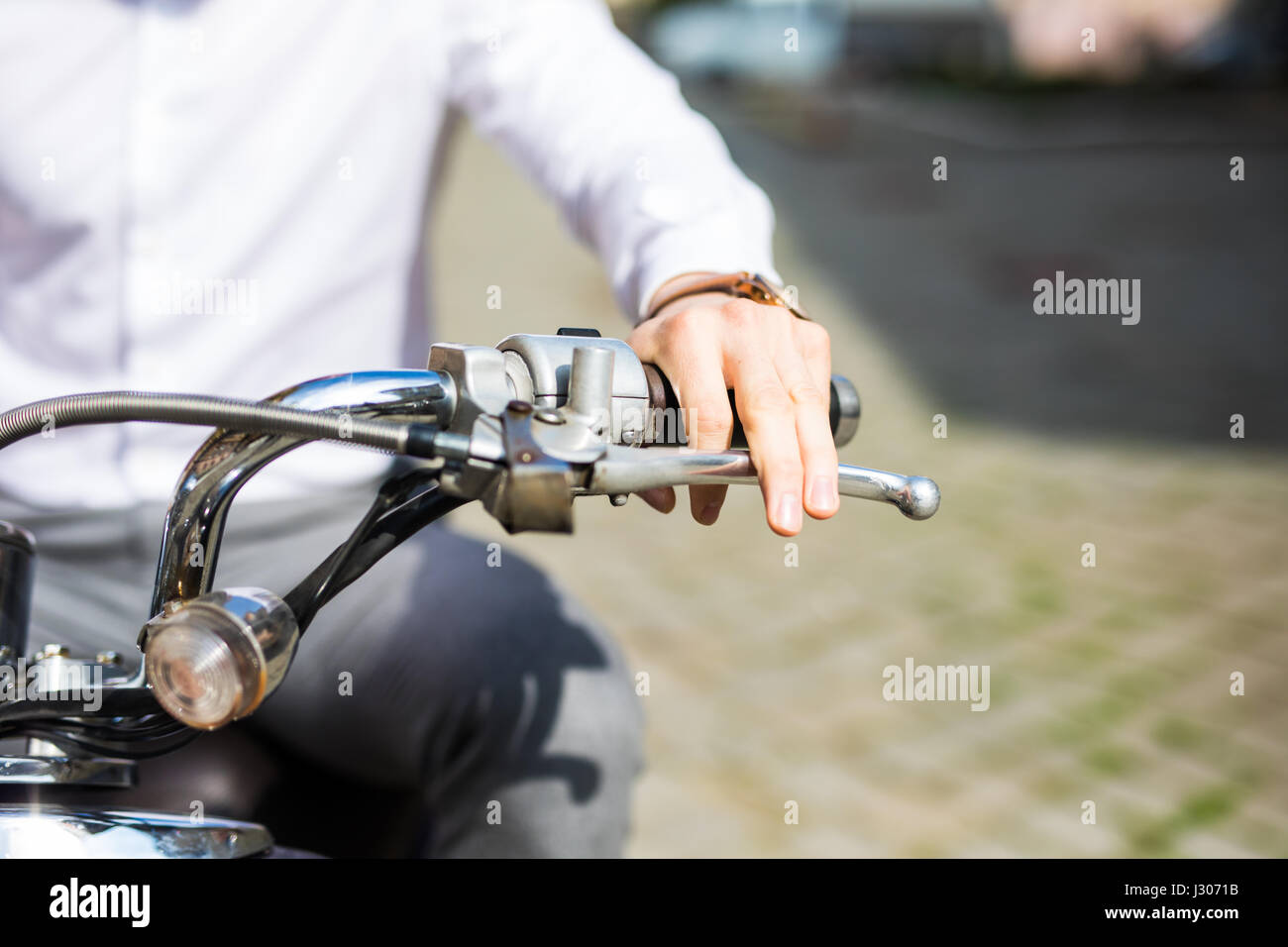 Riding motorcycle, close up of hand on handlebar Stock Photo - Alamy