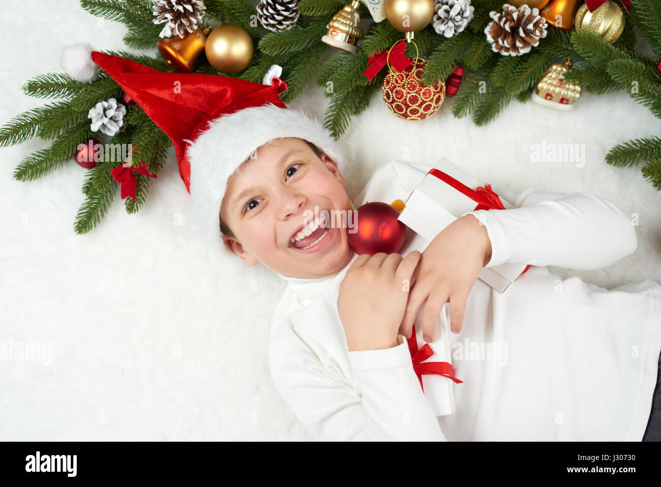 boy child having fun with christmas decoration, face expression and ...
