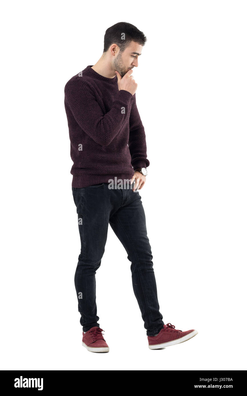 Thoughtful stressed casual man walking and looking down. Full body ...