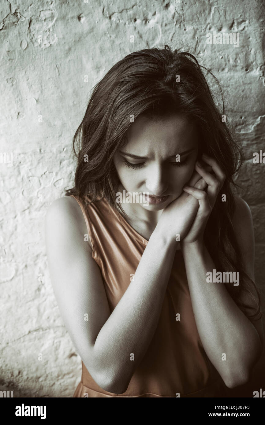 Female scared looking down hi-res stock photography and images - Alamy