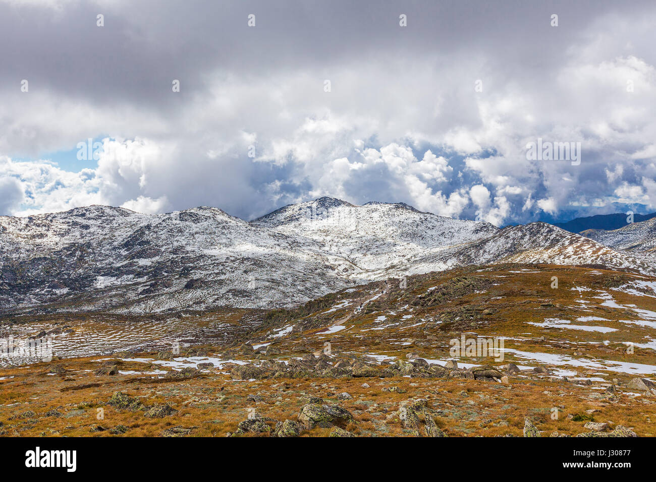 Snow covered mountains under beautiful clouds in Australia Stock Photo ...