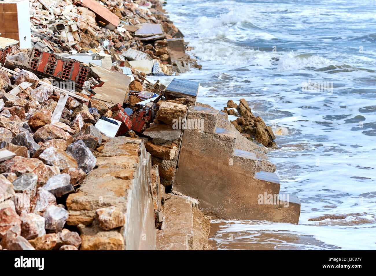 Damaged beach houses. The wind and waves is washed away the beach ...
