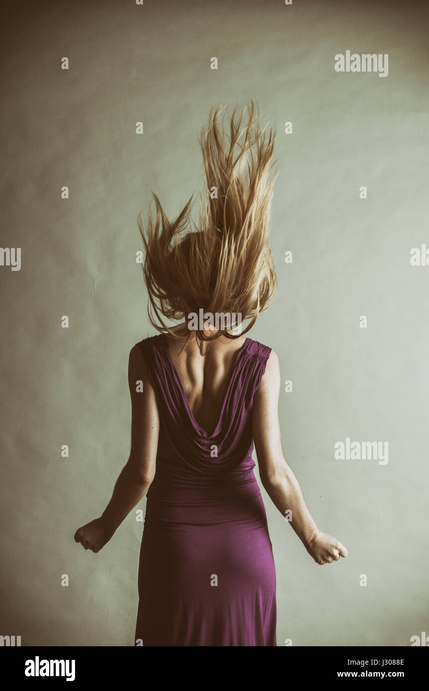 Woman flicking hair rear hi-res stock photography and images - Alamy