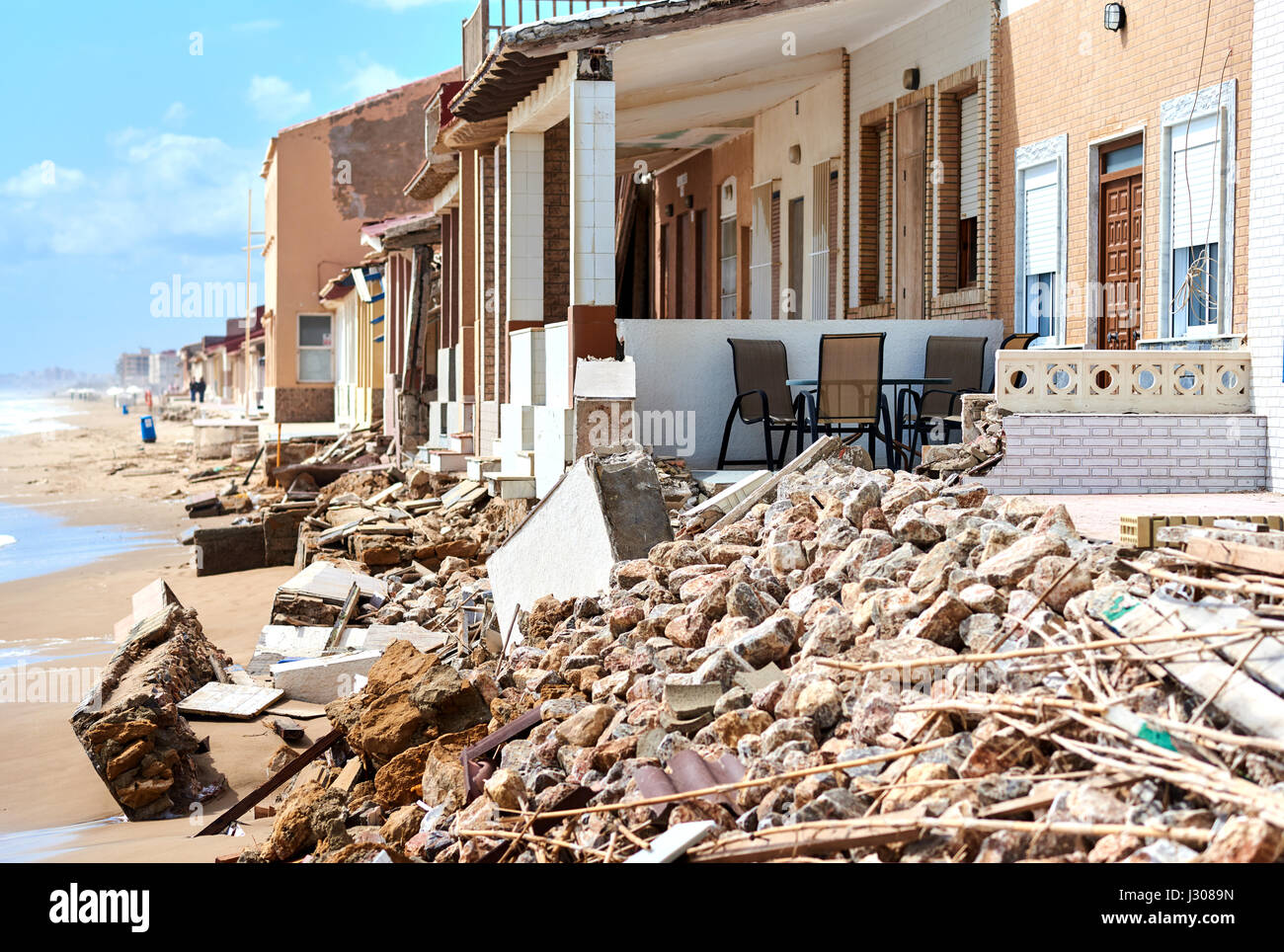Damaged beach houses. The wind and waves is washed away the beach ...
