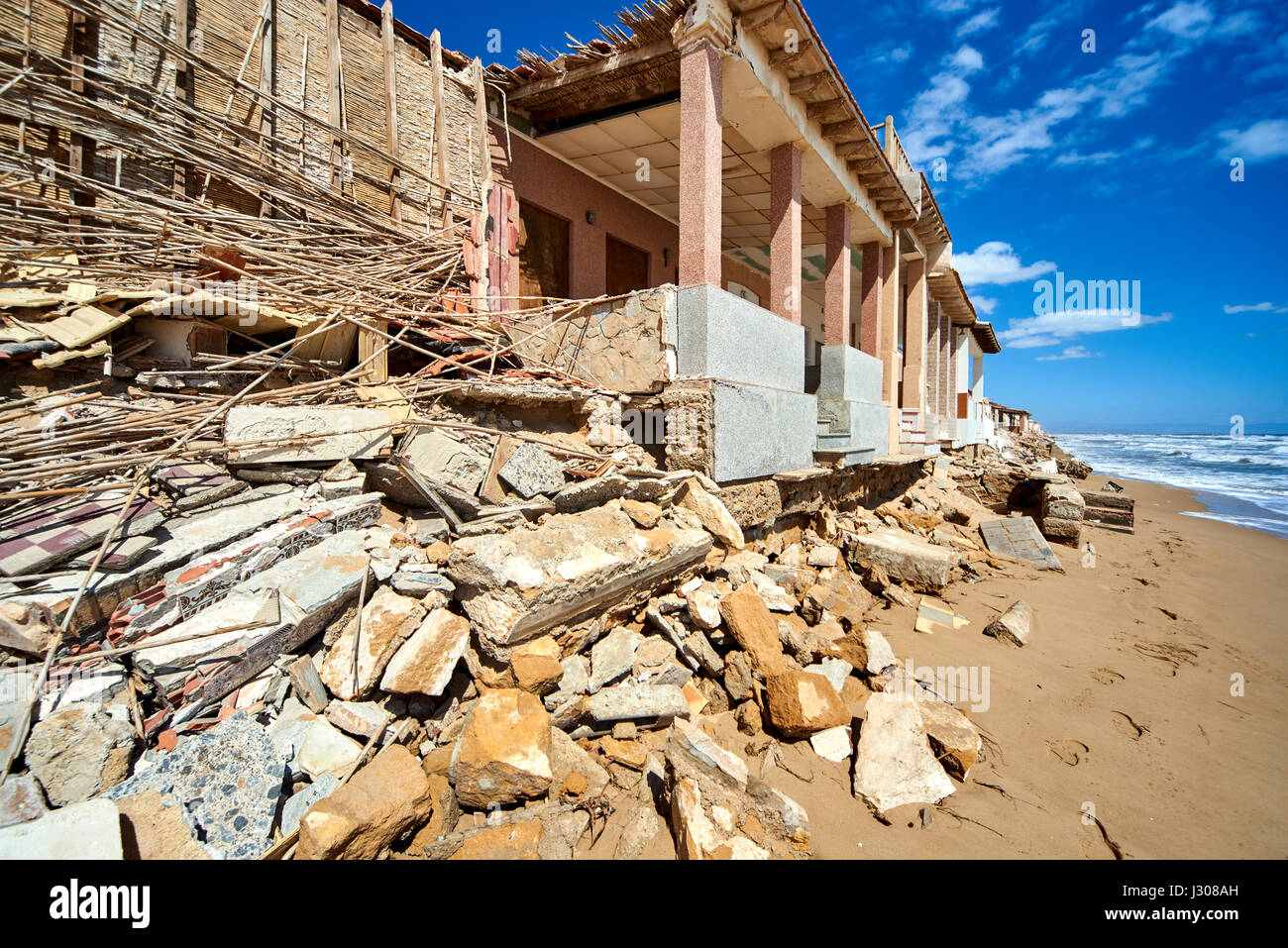 Damaged beach houses. The wind and waves is washed away the beach ...