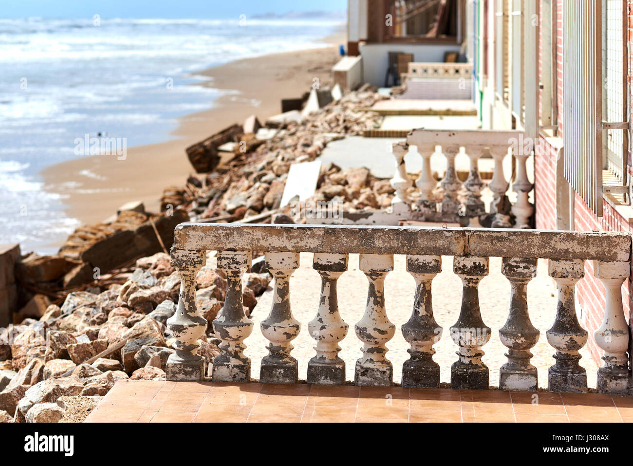 Damaged beach houses. The wind and waves is washed away the beach ...