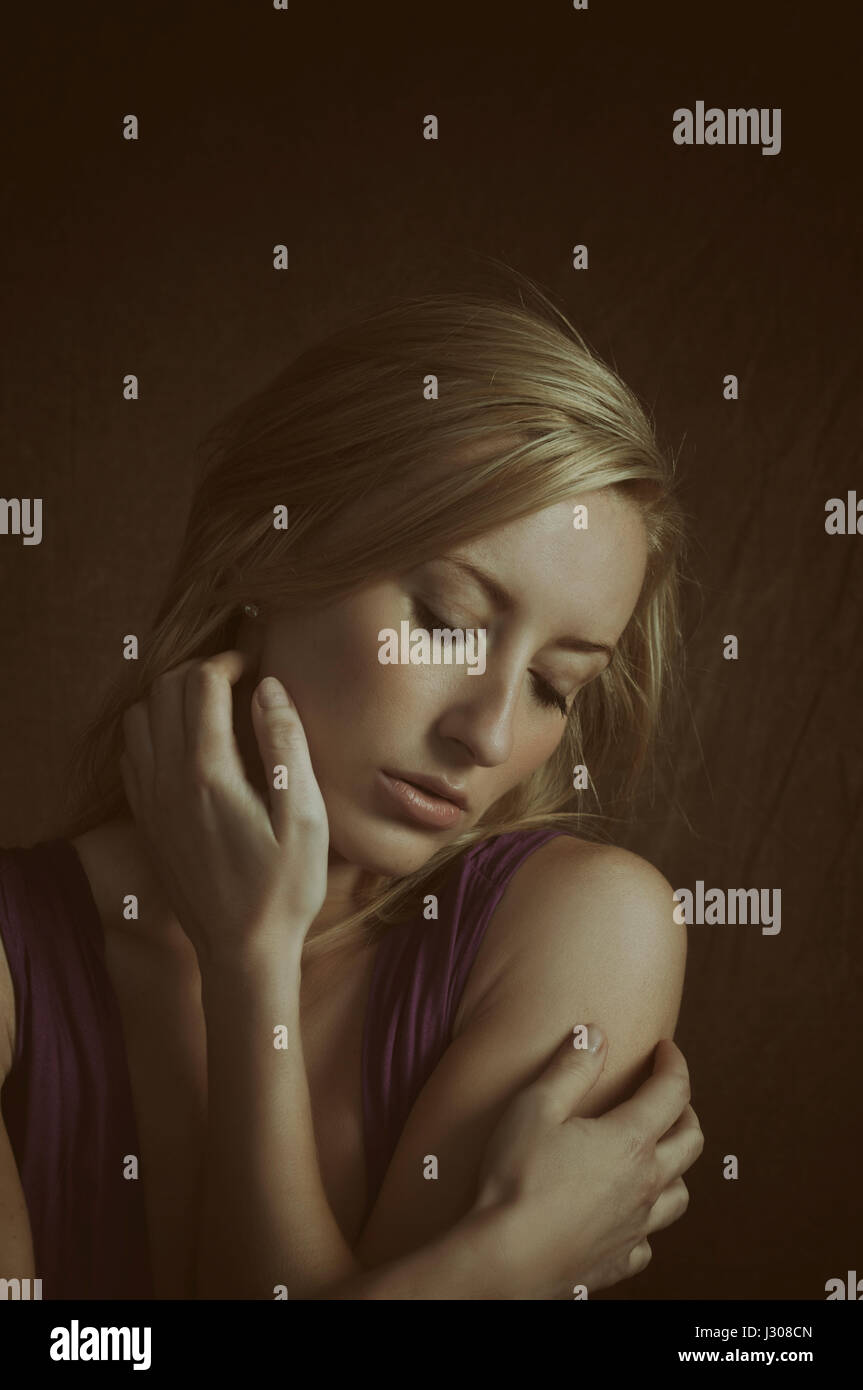 Sad young woman hands touching face Stock Photo - Alamy