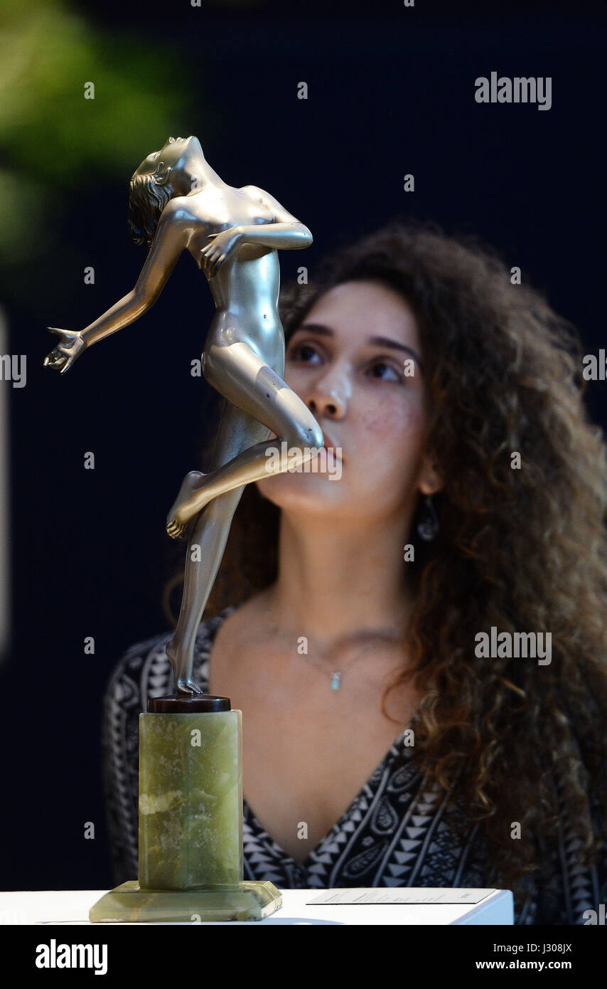 Bonhams' Raphaelle Benabou looks at an Art Deco statue valued at 8 ...