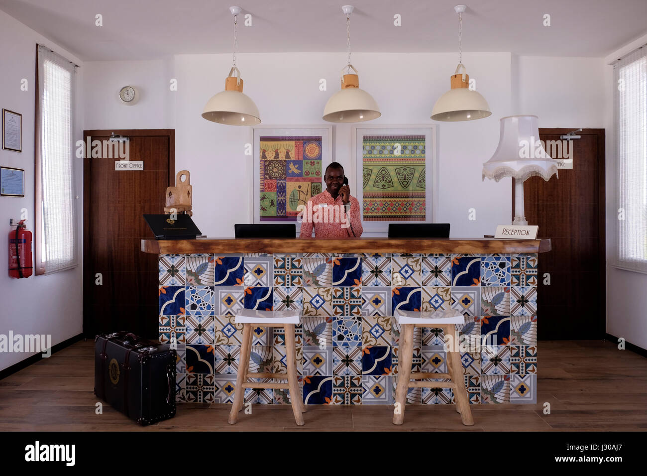 African hotel receptionist hi-res stock photography and images - Alamy