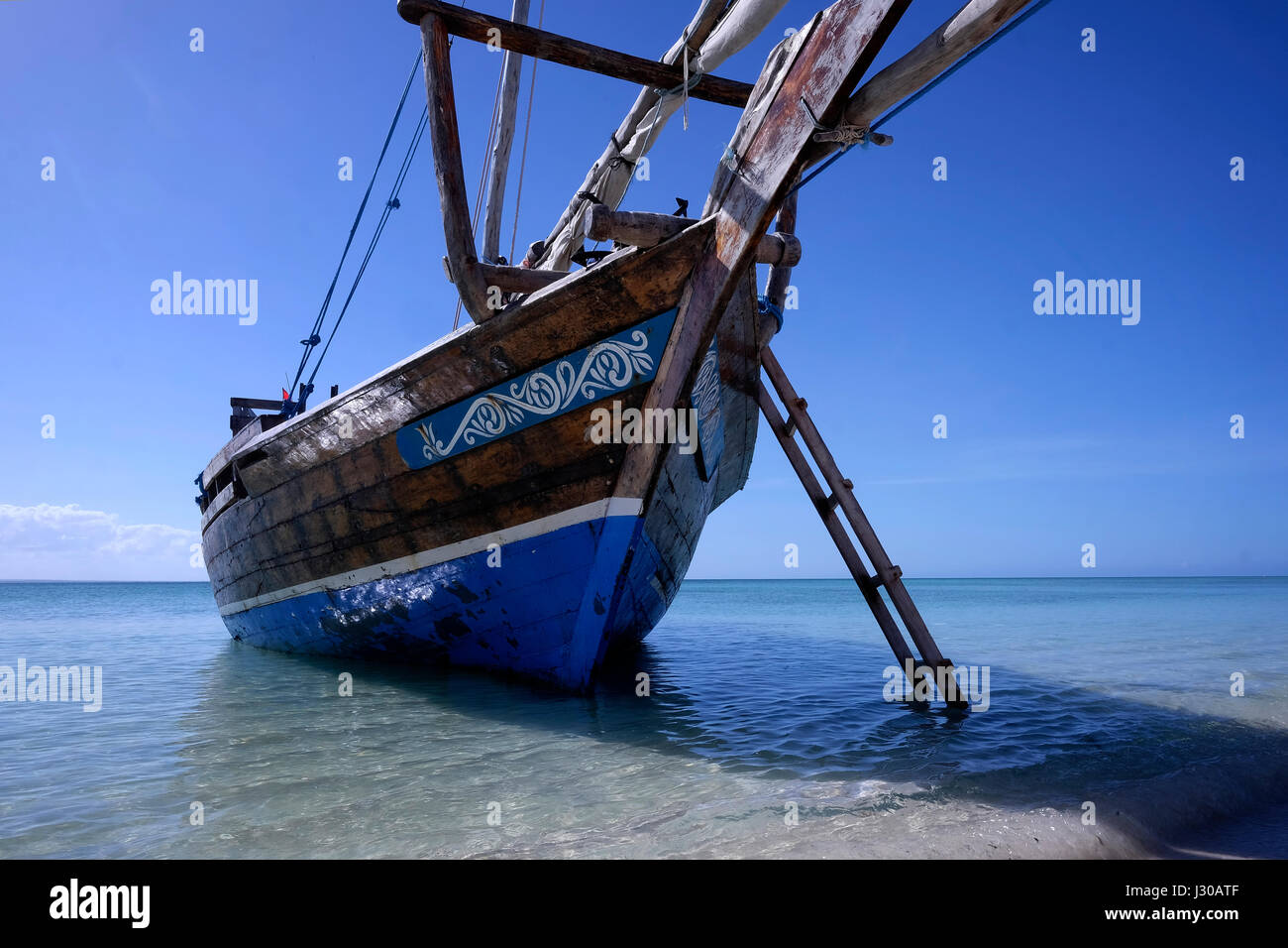 A Dhow traditional sailing vessel at the seashore of the island of ...