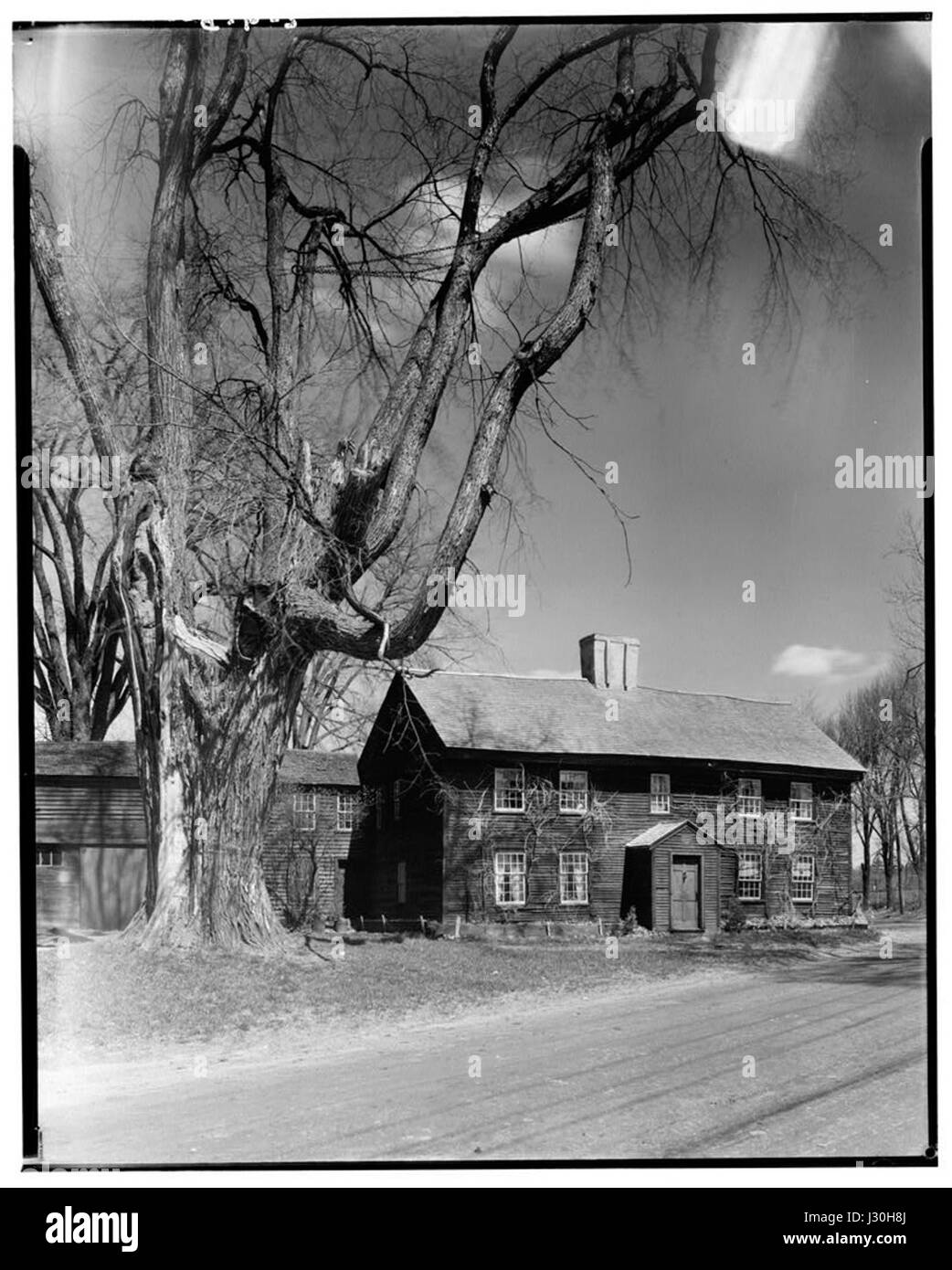 This image depicts the Benjamin Abbott farmhouse, offering a view into ...