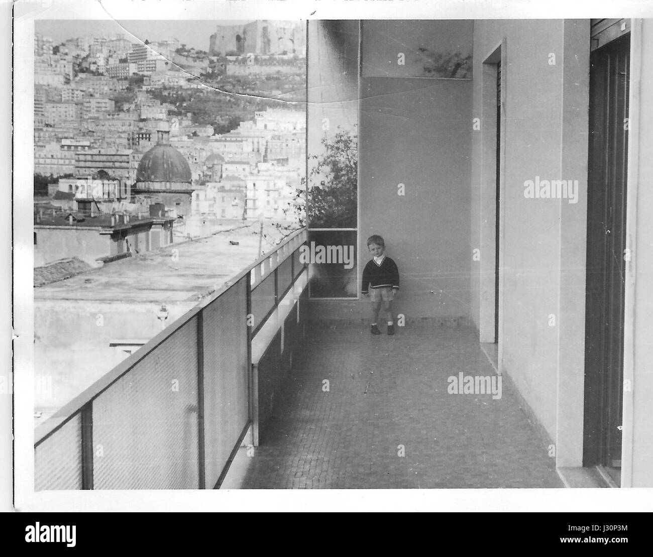 This photograph captures a young boy in Naples, Italy, during the 1950s ...