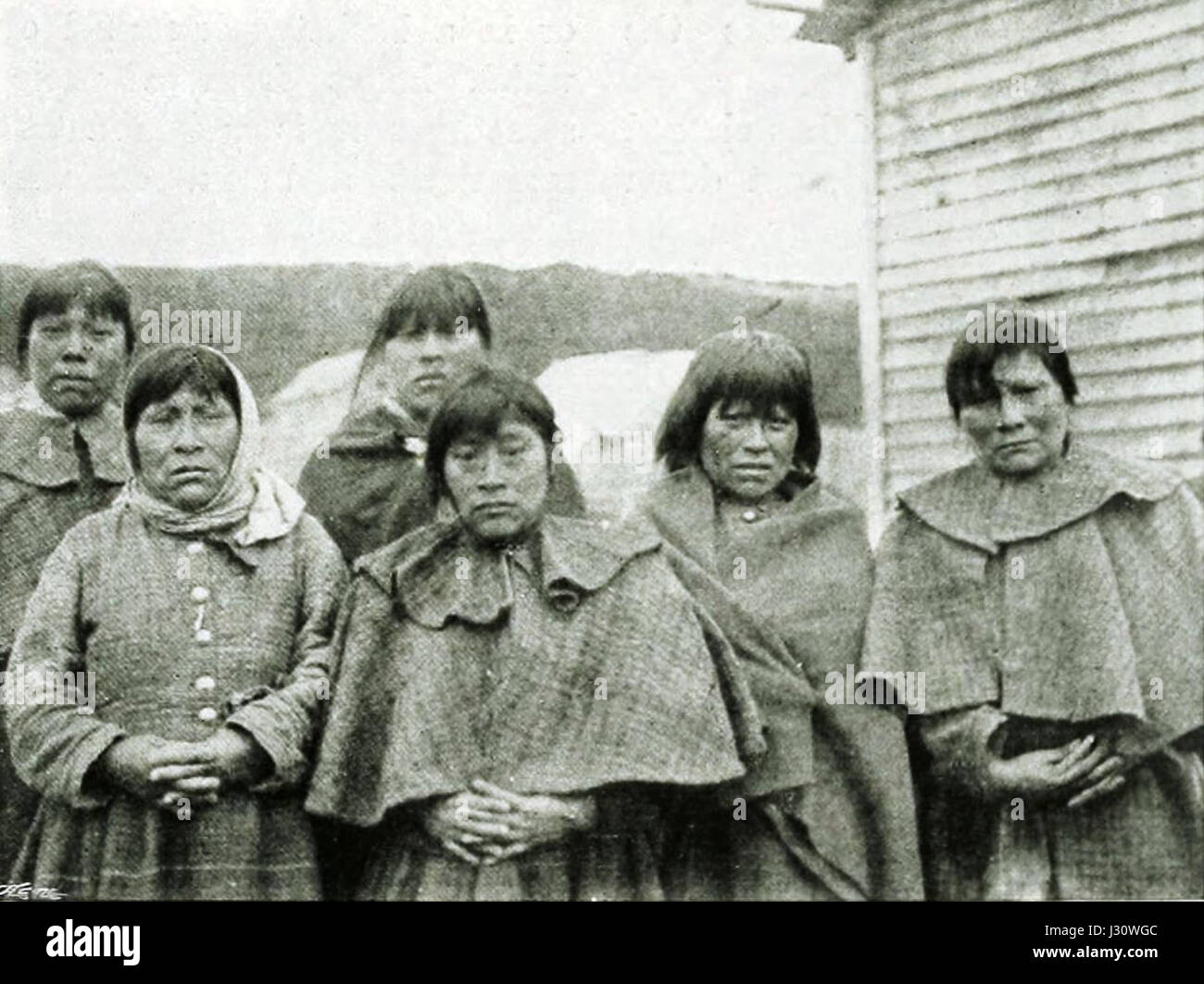 Alacaluf women, an indigenous group from Patagonia, are depicted ...