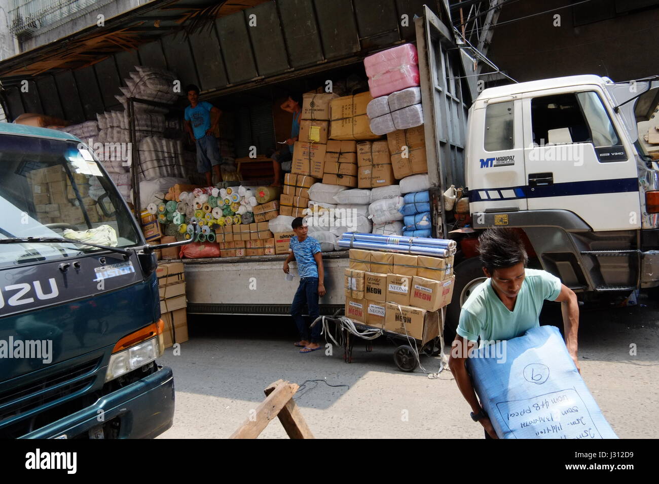 A worker prepares the cargo for truck loading on Labor Day. (Photo by ...