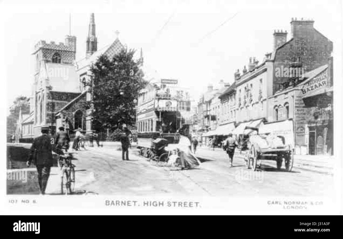 A view of Barnet High Street, showing a tram traveling through the busy ...