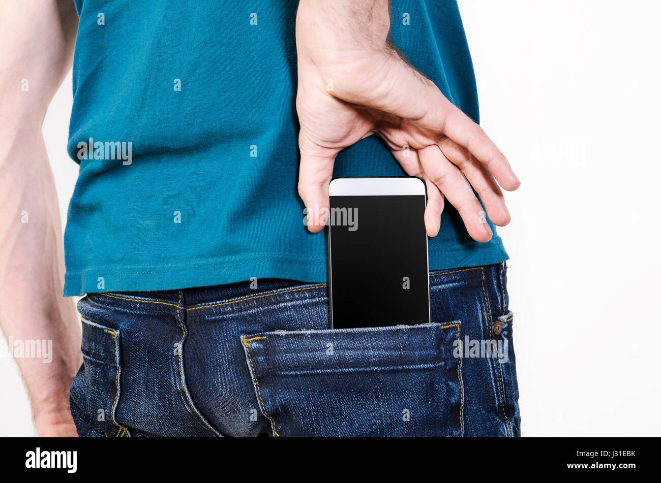 Mobile phone in a pocket Stock Photo - Alamy