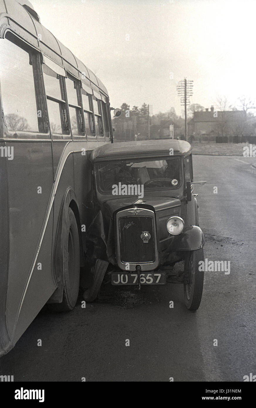 1950, a single-decker passenger bus and a pre-ww2 Austin 7 motor car in ...