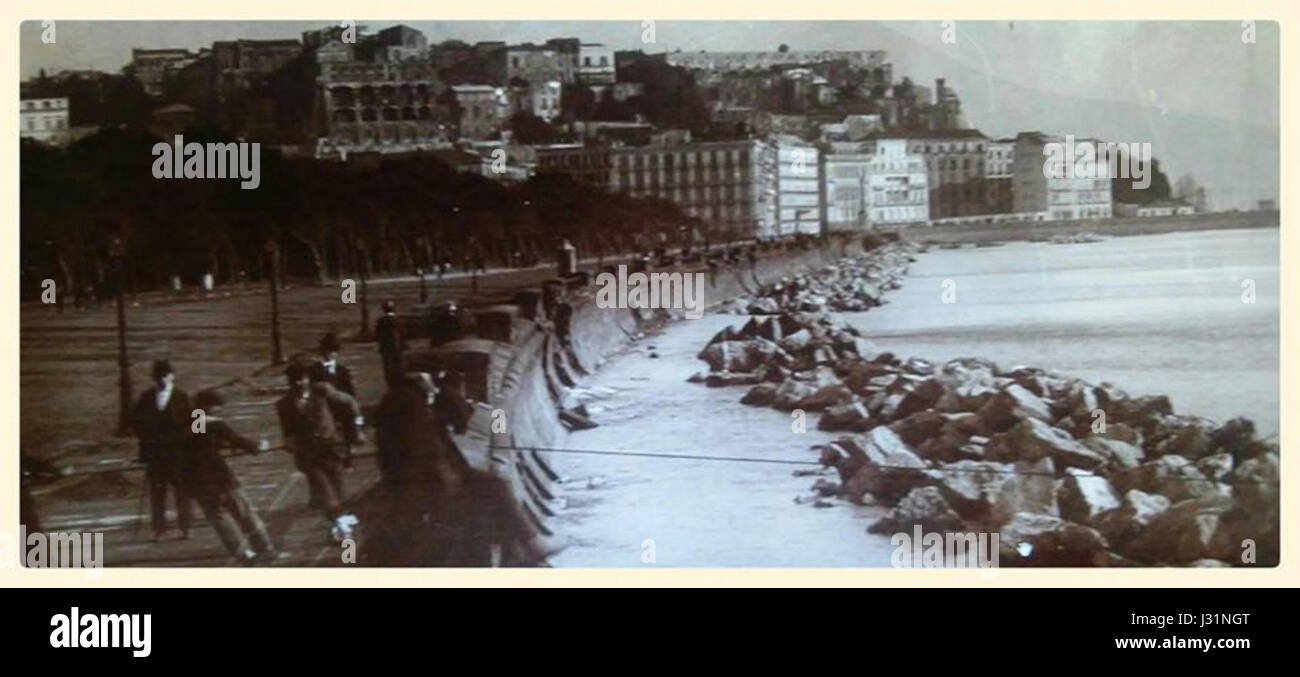 This image captures a scene from Via Caracciolo in Naples, Italy. The ...