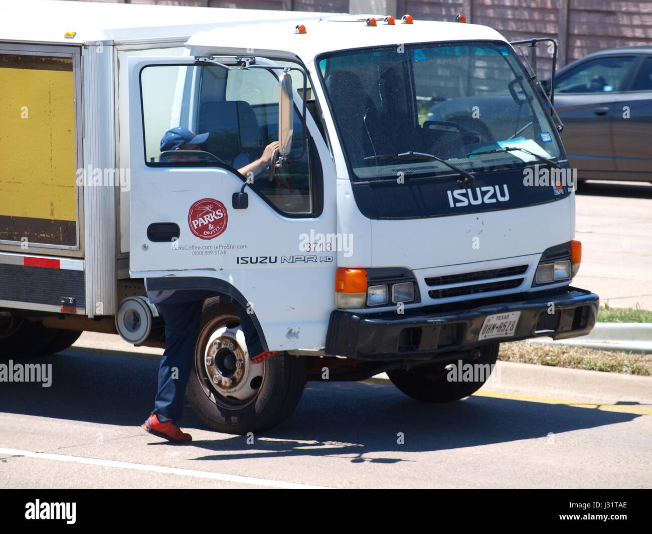 Car turning left intersection hi-res stock photography and images - Alamy