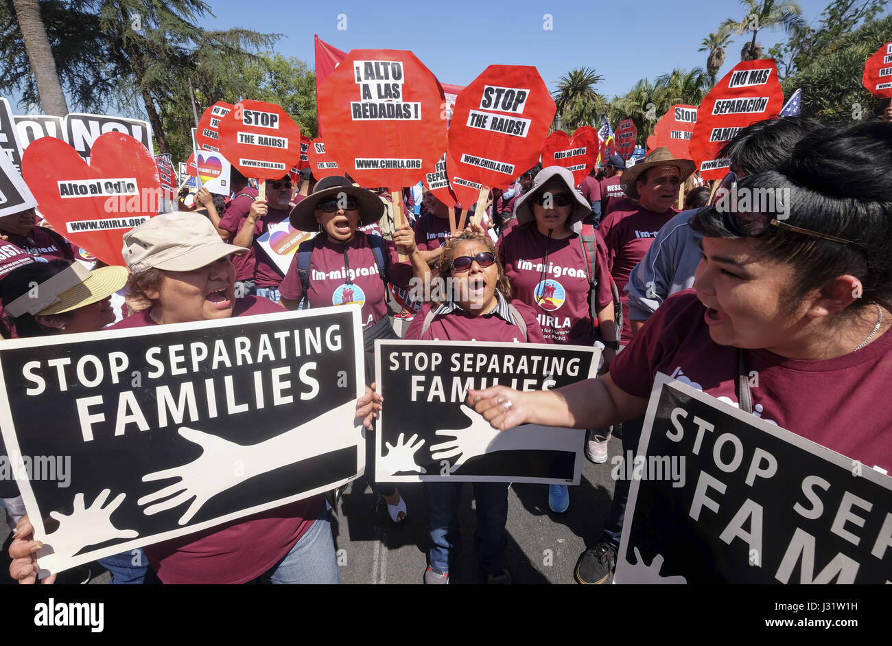 Los Angeles, California, USA. 1st May, 2017. Protesters carry signs ...