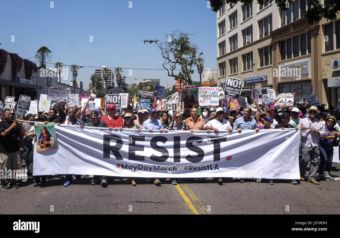 Los Angeles, California, USA. 1st May, 2017. Protesters carry signs ...