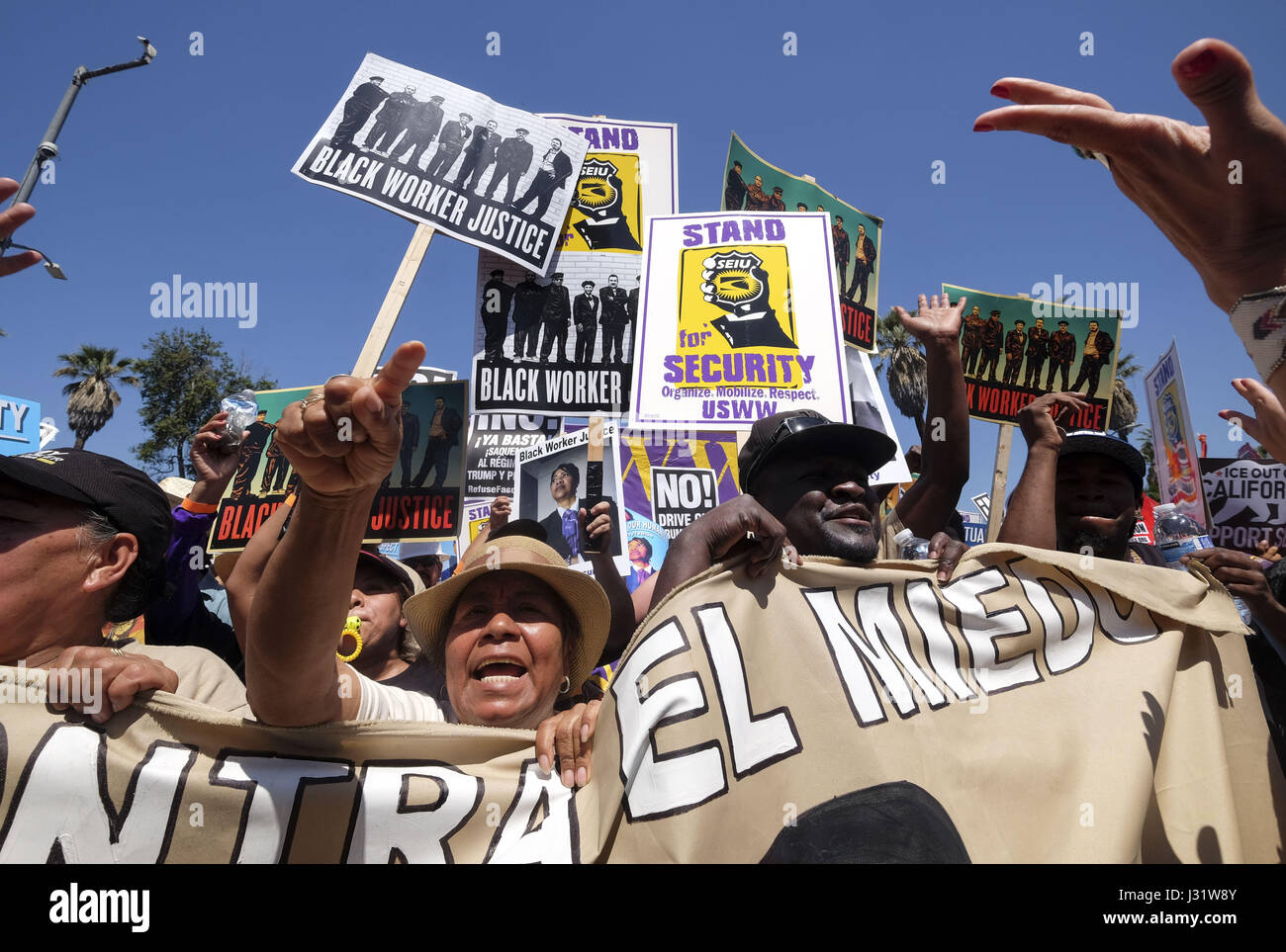 Los Angeles, California, USA. 1st May, 2017. Protesters carry signs ...