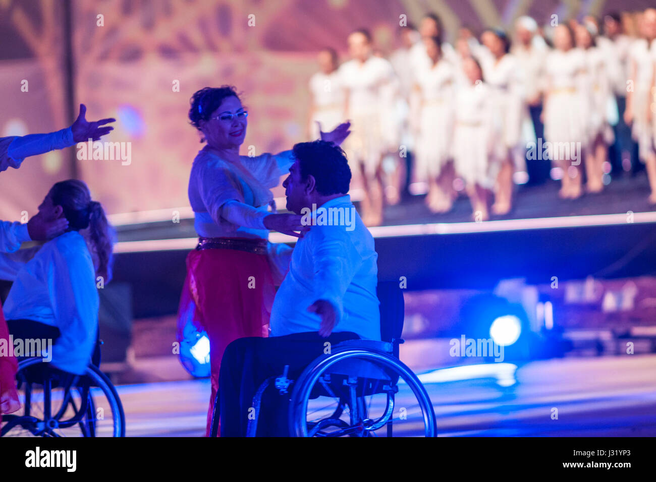 Disabled dancers in wheelchairs dance with other dancers during the ...