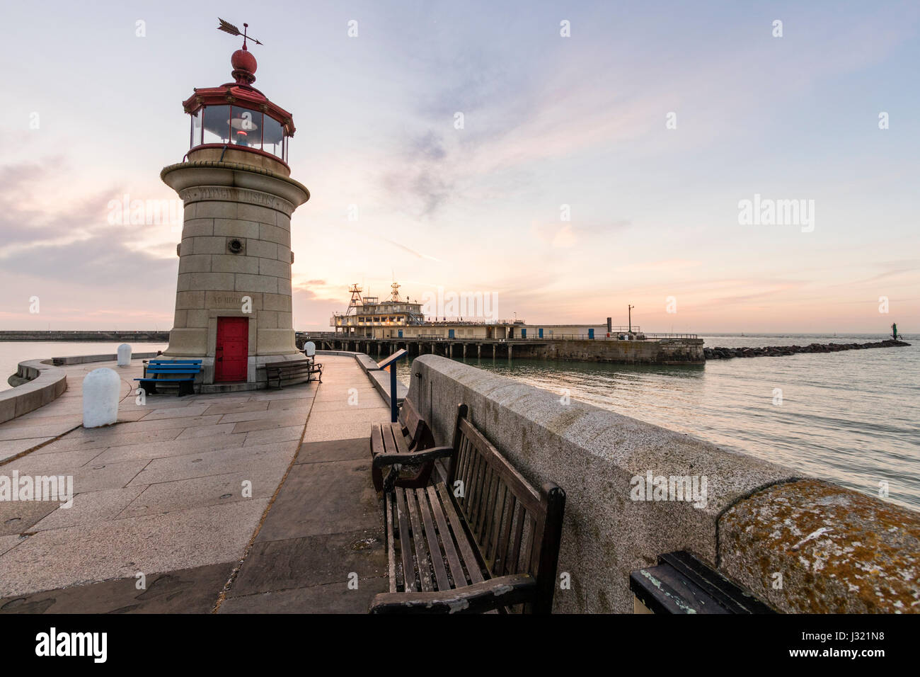 England, Ramsgate harbour. Dawn sky with lighthouse at end of harbour ...