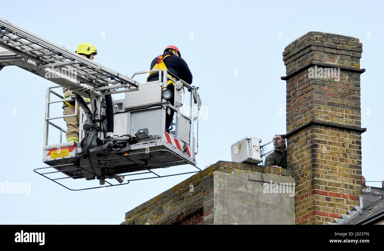 Brighton, UK. 2nd May, 2017. A fire brigade cherry picker is used to ...