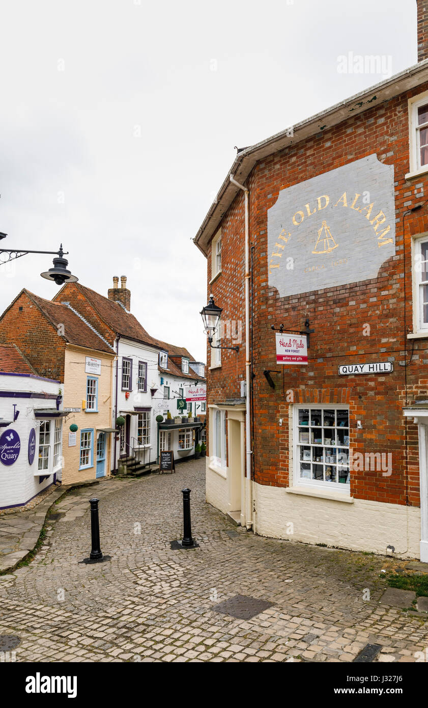 Cobbled Quay Hill and an alleyway of quaint local shops and historic ...