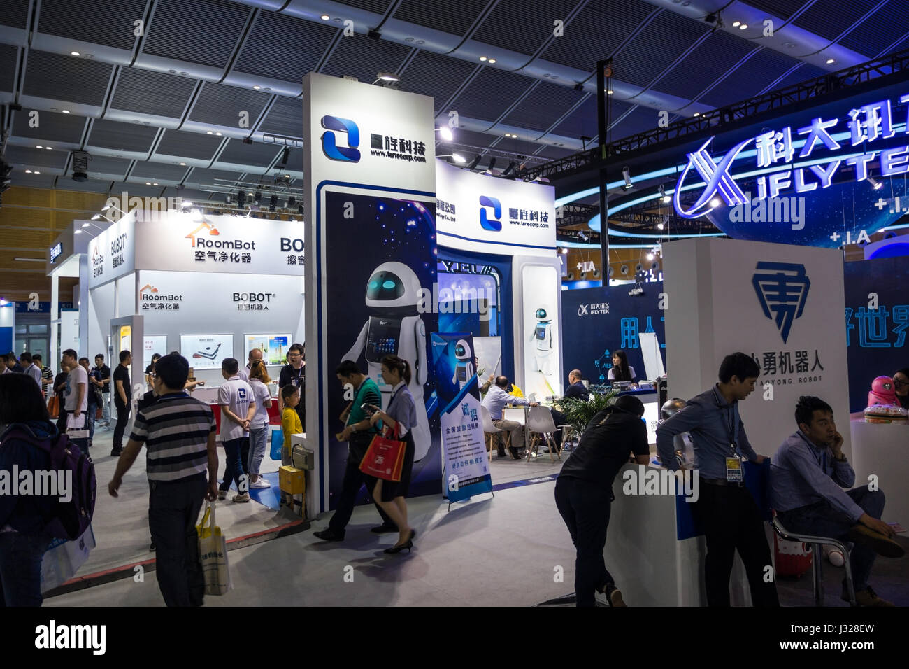 China robot brands displaying robots at a fair Stock Photo - Alamy