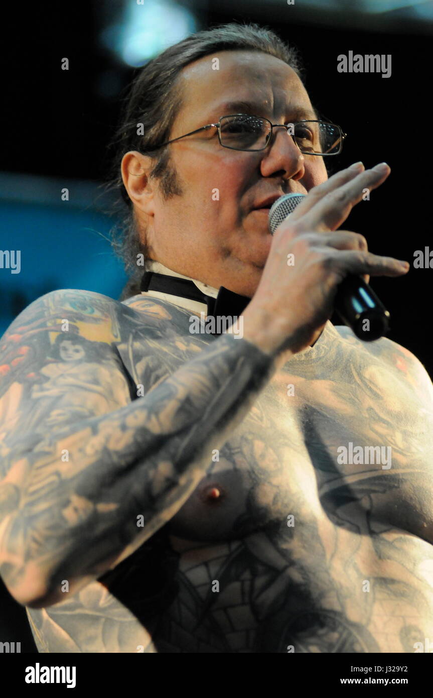 Tattooed speaker talks at Tattoo and Piercing Convention in Lyon Stock ...