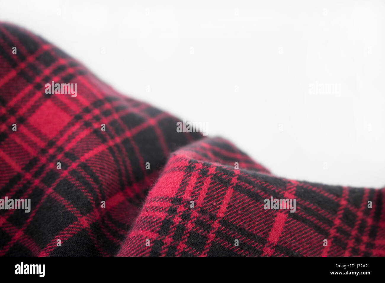 Red plaid flannel fabric cloth tartan garment textile Stock Photo - Alamy