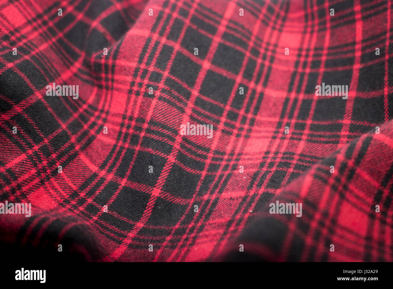 Red plaid flannel fabric cloth tartan garment textile Stock Photo - Alamy