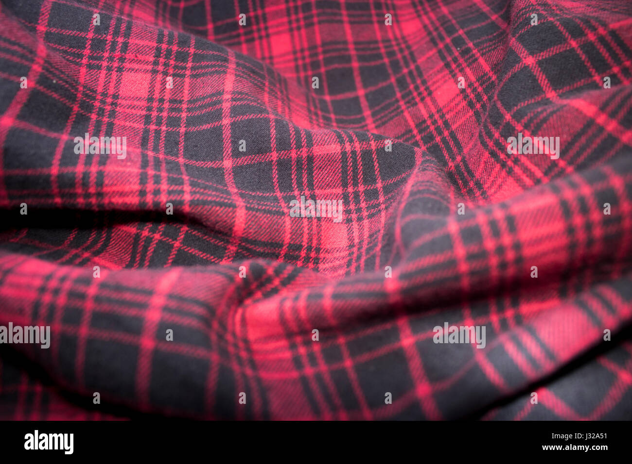 Red plaid flannel fabric cloth tartan garment textile Stock Photo - Alamy